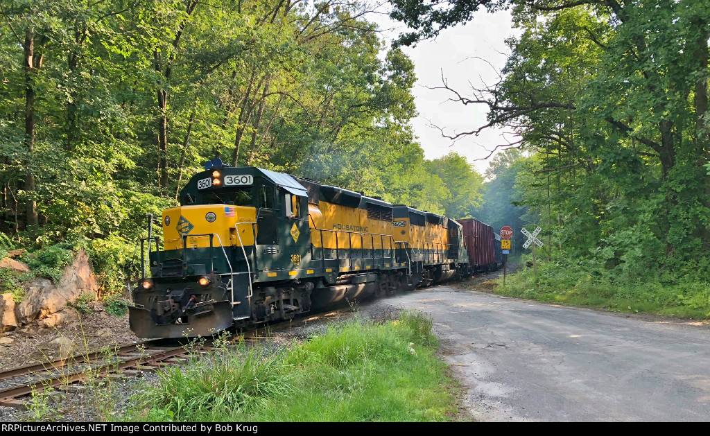 HRRC 3601 leads train NX-12 over the River Road grade crossing